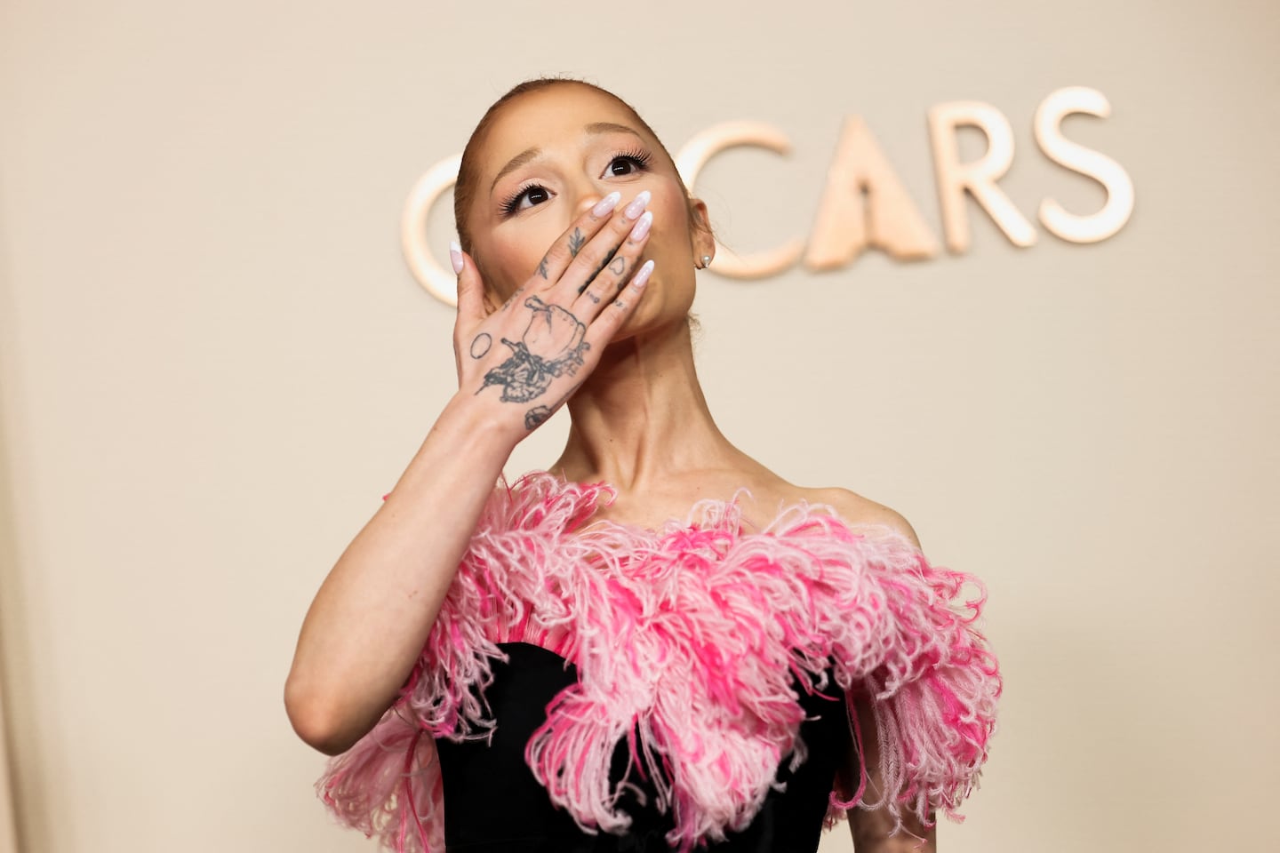 Ariana Grande stuns in perfectly pink peplum dress at the 97th Academy ...